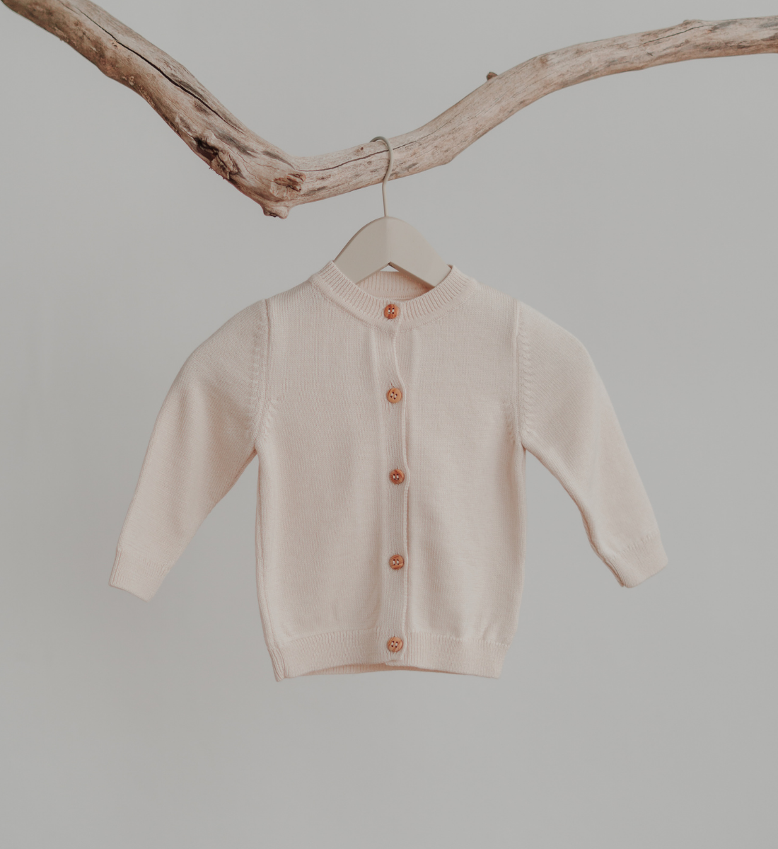 Lil' Leo: Cardigan in Creme aus 100% Merinowolle